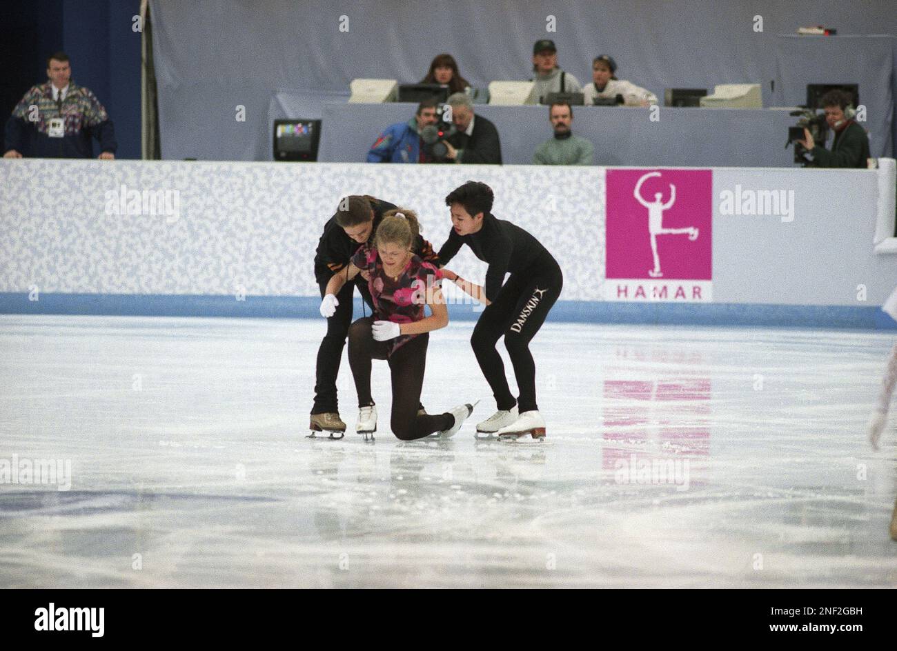German figure skater Tanja Szewczenko gets helped up by Katarina Witt ...