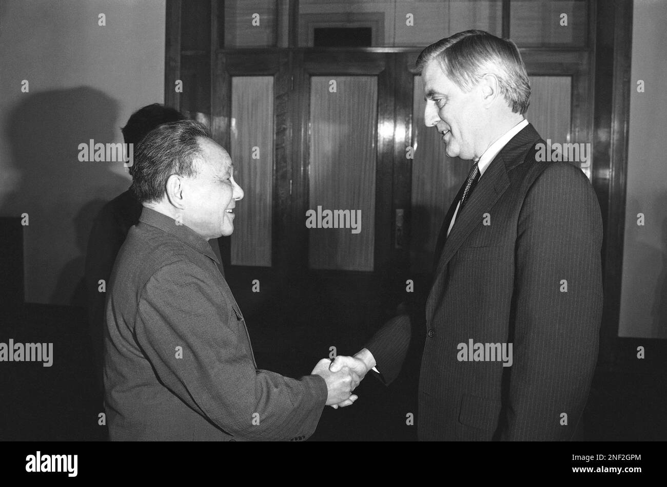 Chinese Vice Party Chairman Deng Xiaoping, left, welcomes former U.S ...