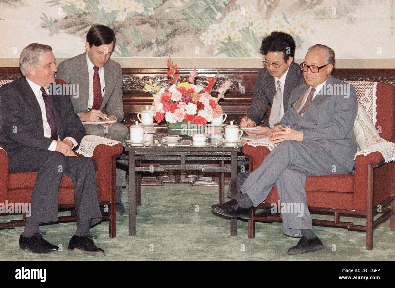 Former U.S. Vice President Walter Mondale, left, on a private business ...