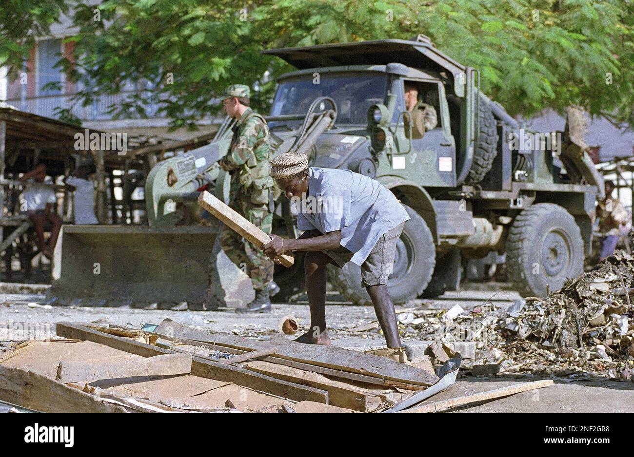 Previlis Joseph, 18, volunteers his help during a joint operation ...