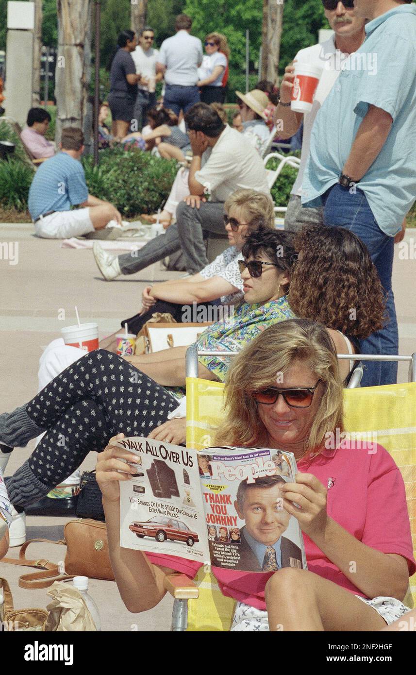 Katy Rutledge of San Diego, Calif., keeps up with the latest on ...