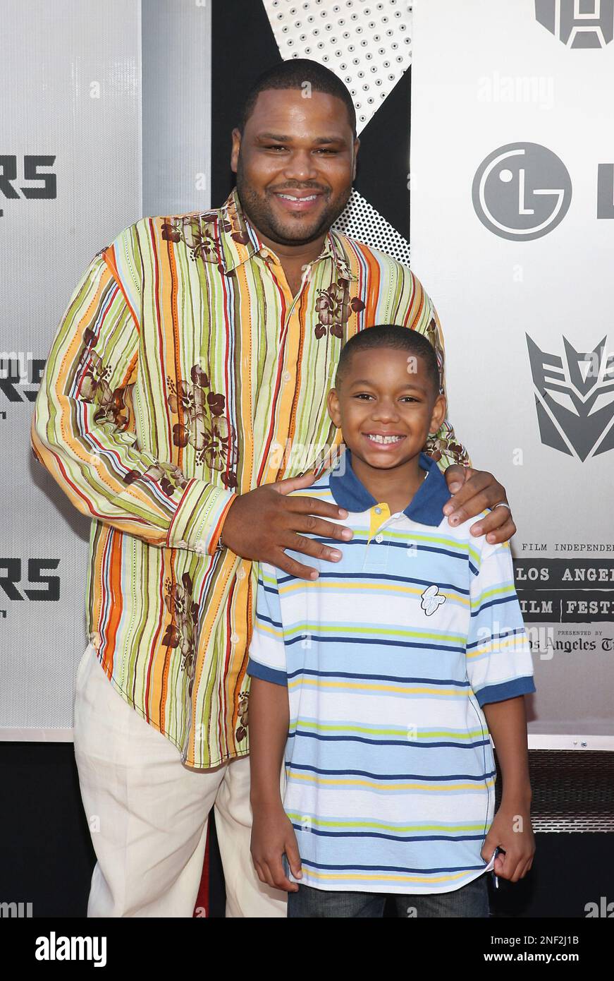 Anthony Anderson, left, and his son arrive at the "Transformers ...