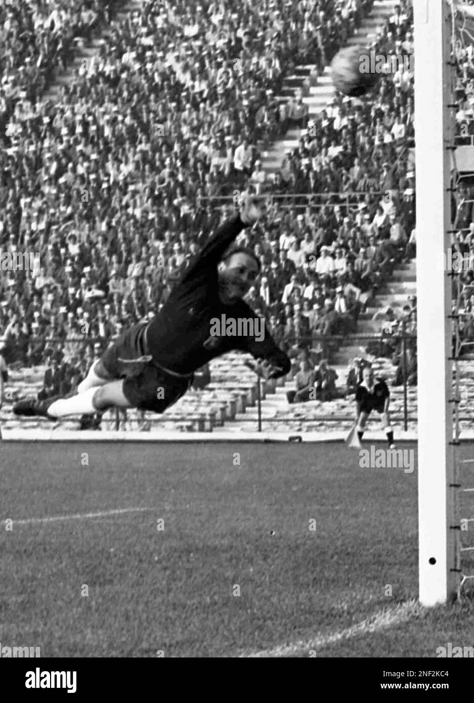 Chile's goalkeeper Misael Escuti dives but fails to save the shot from ...