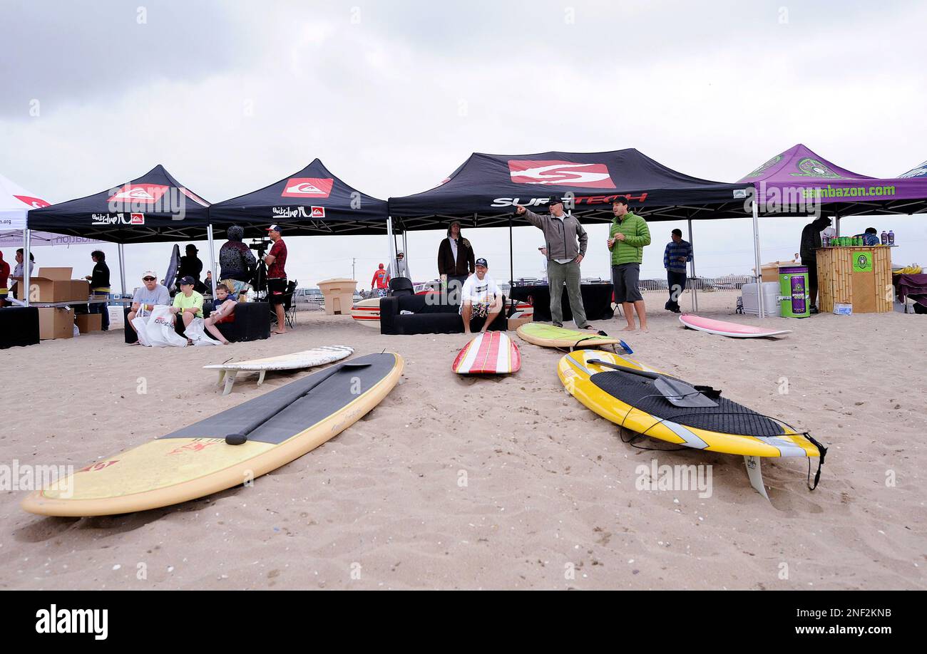 Surfers and beach clean up volunteers attend the Quicksilver Foundation ...