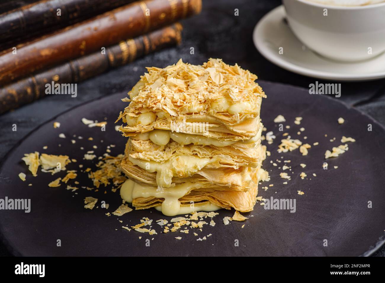 napoleon puff pastry cake on black. made from puff pastry with custard ...