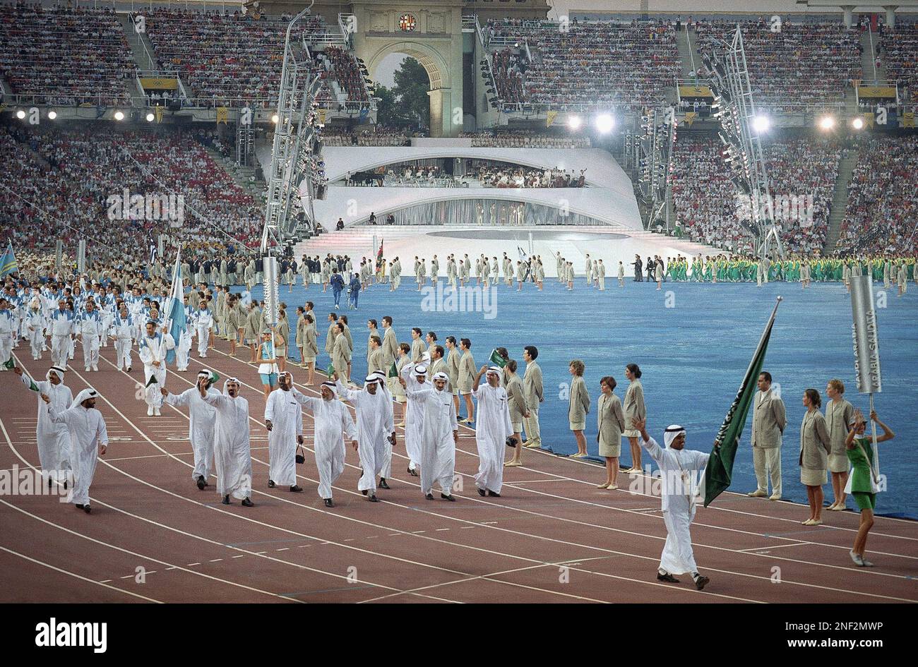 Members of Saudi Arabia's team walk in Olympic Stadium in Barcelona ...