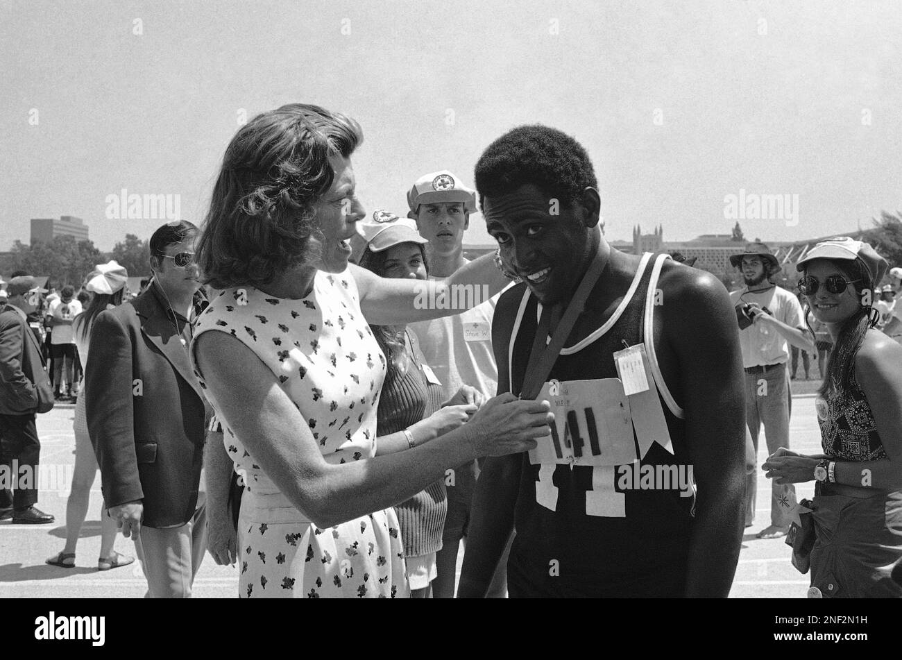 Adonis Brown, 18, of Baltimore, Md. smiles as Mrs. Eunice Kennedy ...