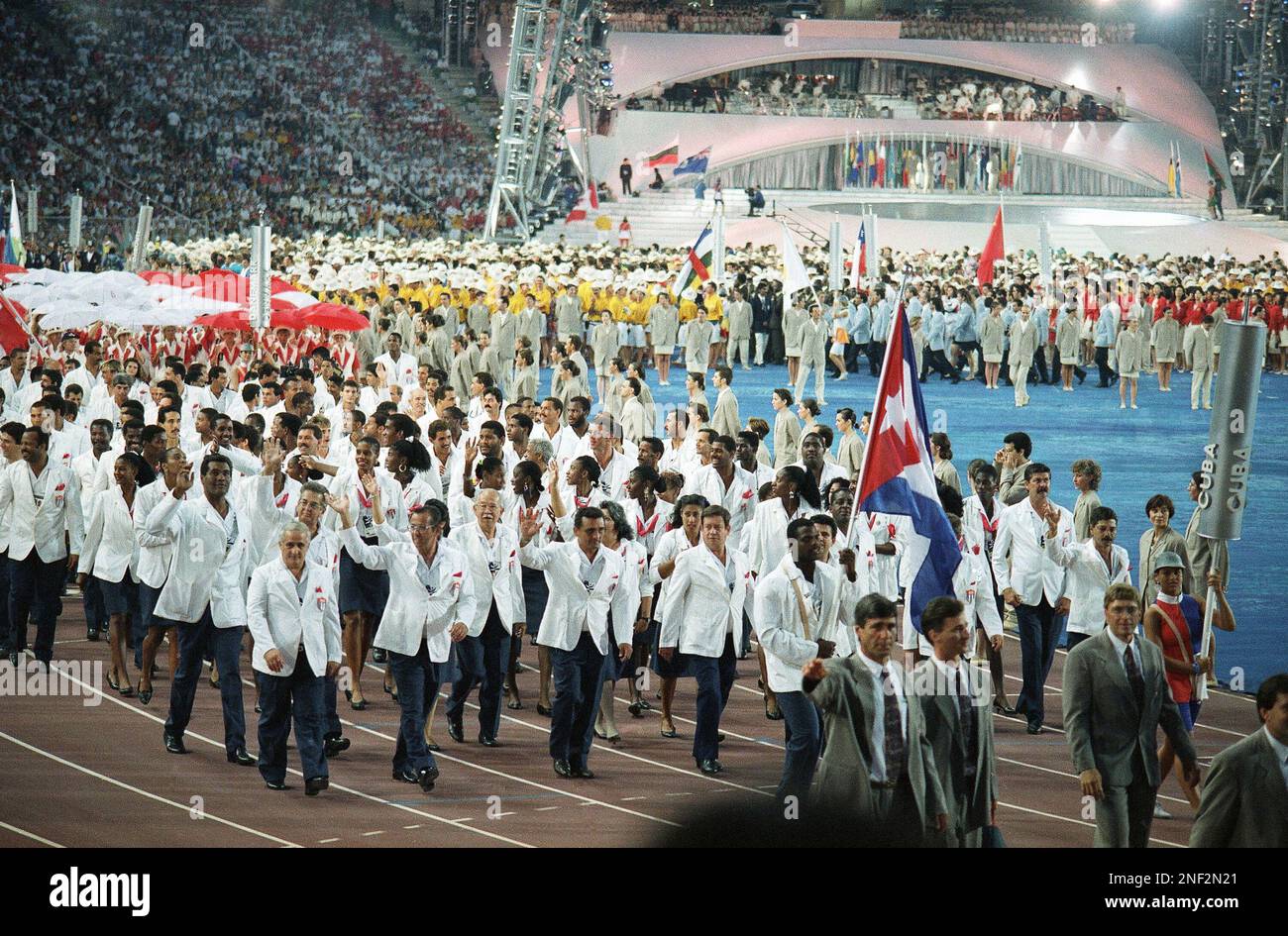 Members of Cuba's Olympic team march in the Olympic Stadium in ...