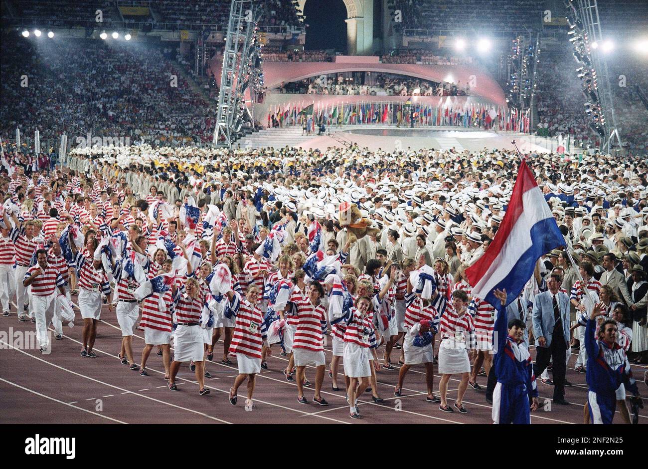 The Netherlands Olympic team follow their flag at the Olympic Stadium ...