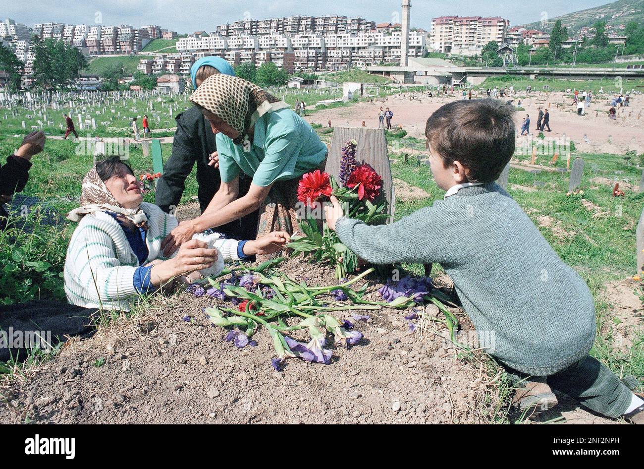 Zehra Subasic, left, is comforted by an unidentified woman as she ...