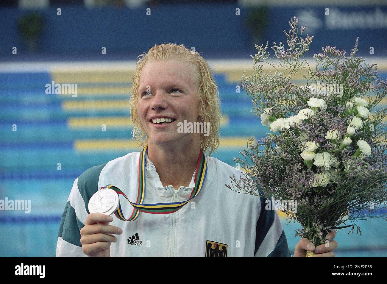 German swimmer Dagmar Hase shows off the silver medal she won in the ...