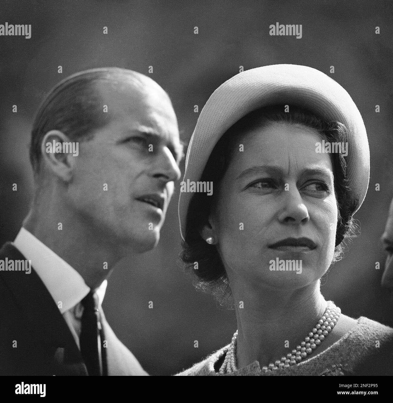 Queen Elizabeth II and Prince Philip are a study in concentration in ...