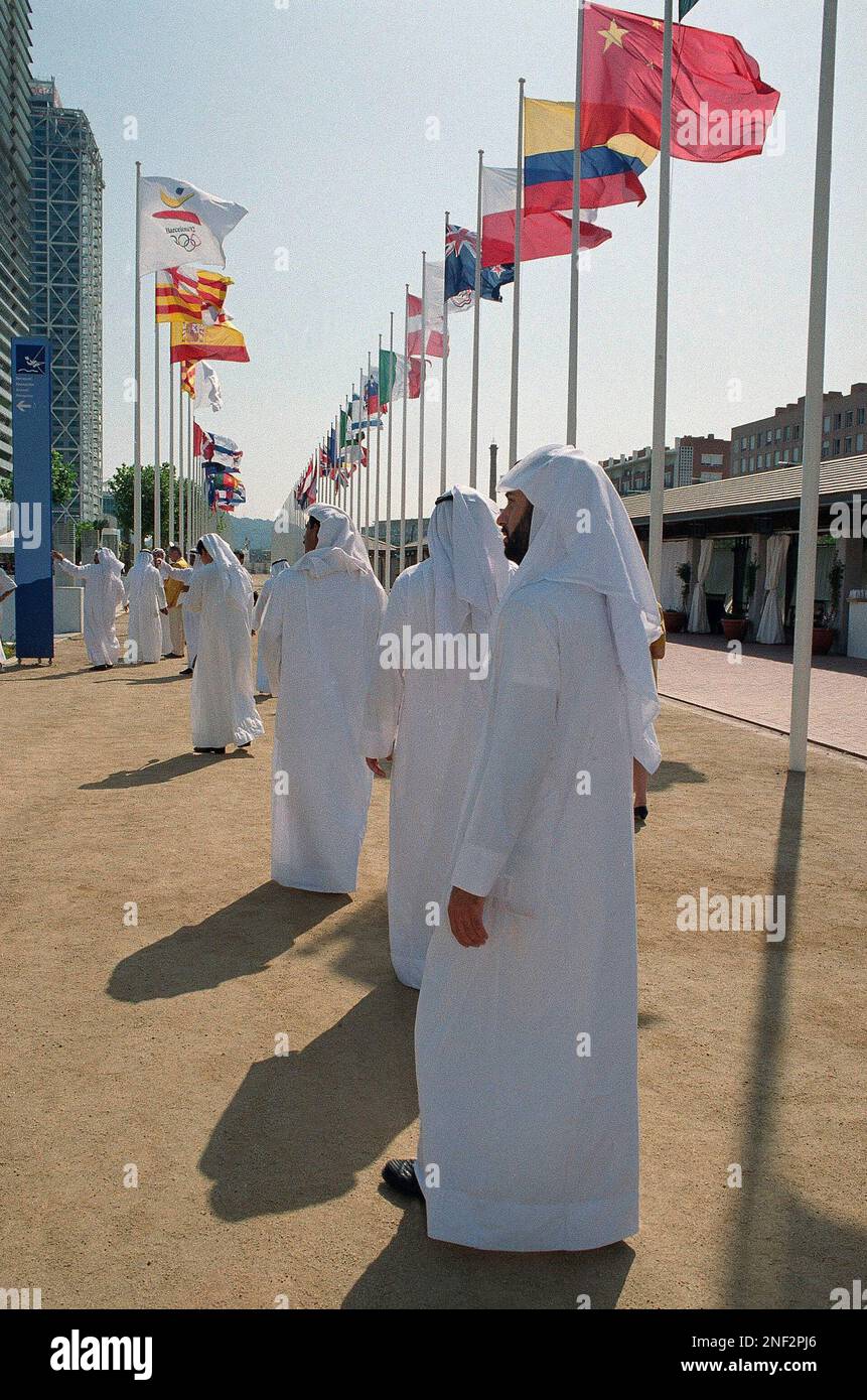 Members of the Kuwait Olympic team pass national flags at the Olympic ...