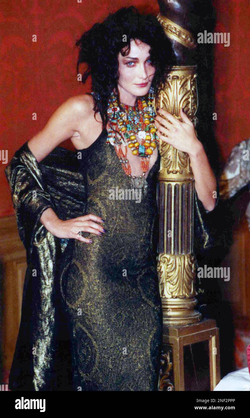 Italian top model Carla Bruni wears a double dress gold knit Jacquard ...