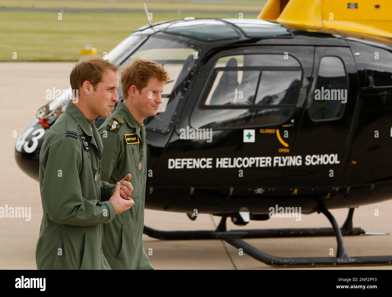 Britain's Prince William, left, and Prince Harry, right, during a phot ...