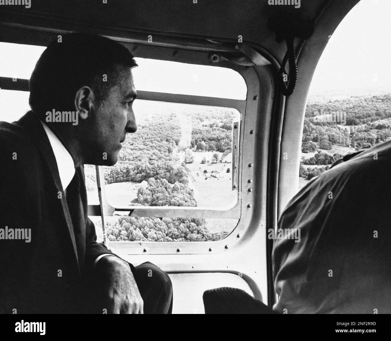 Secretary of Interior Stewart Udall shown taking a helicopter trip over ...