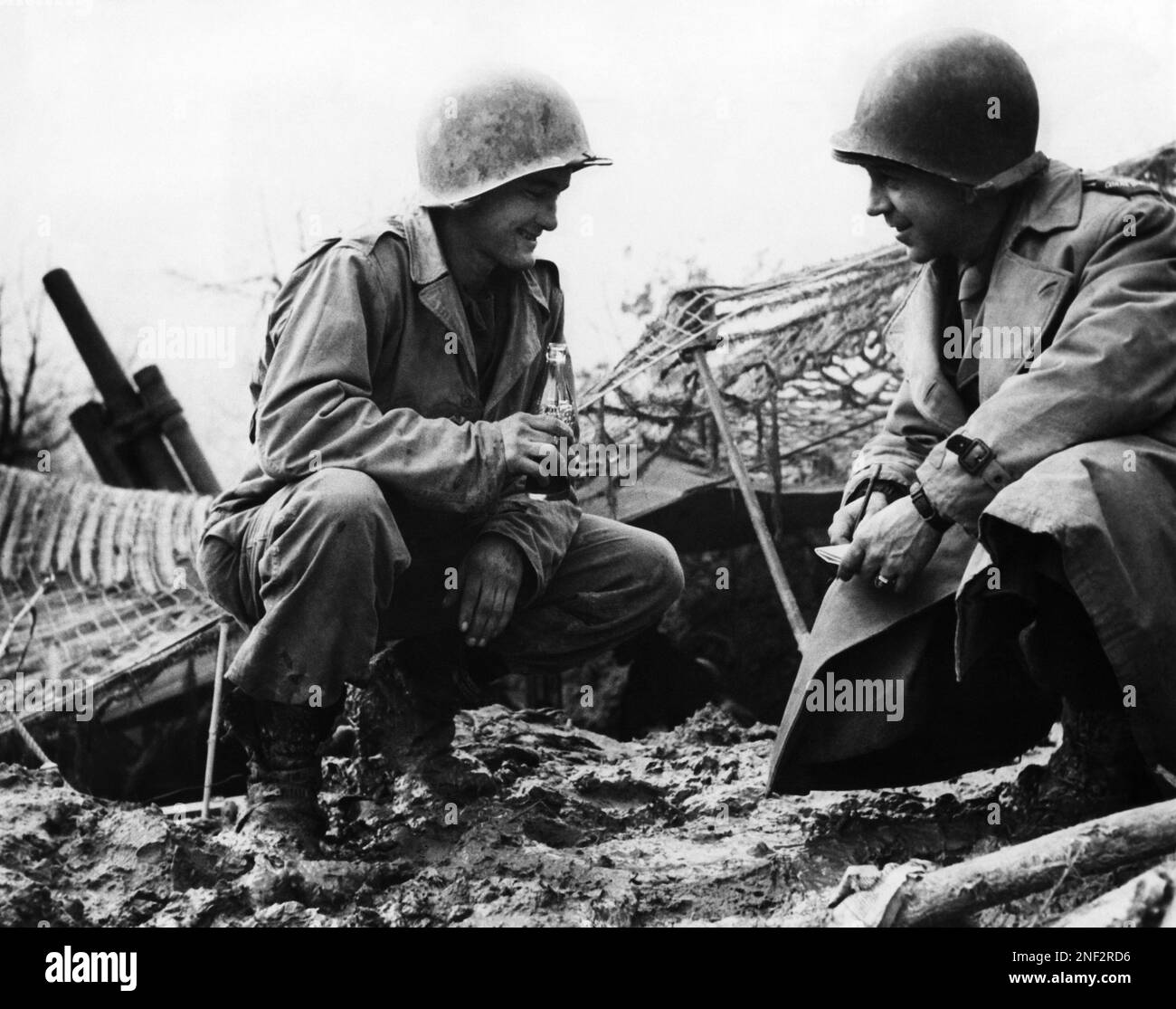 Pvt. Joe Thompson (left) of Philadelphia, Pa., tells his story to an ...