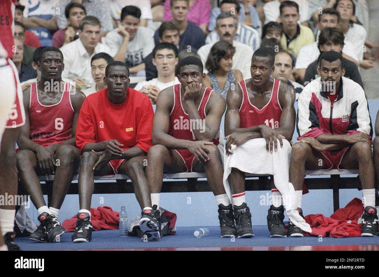 Members of the Angolan Olympic basketball team watch from the bench ...