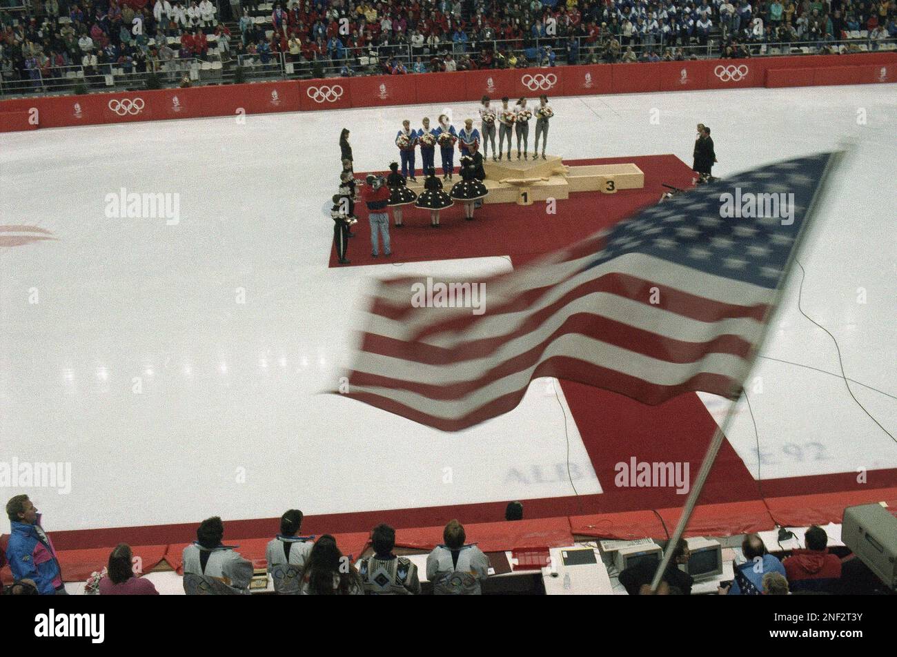 A U.S. flag is waved in the crowd as the women’s 3000-meter short track ...