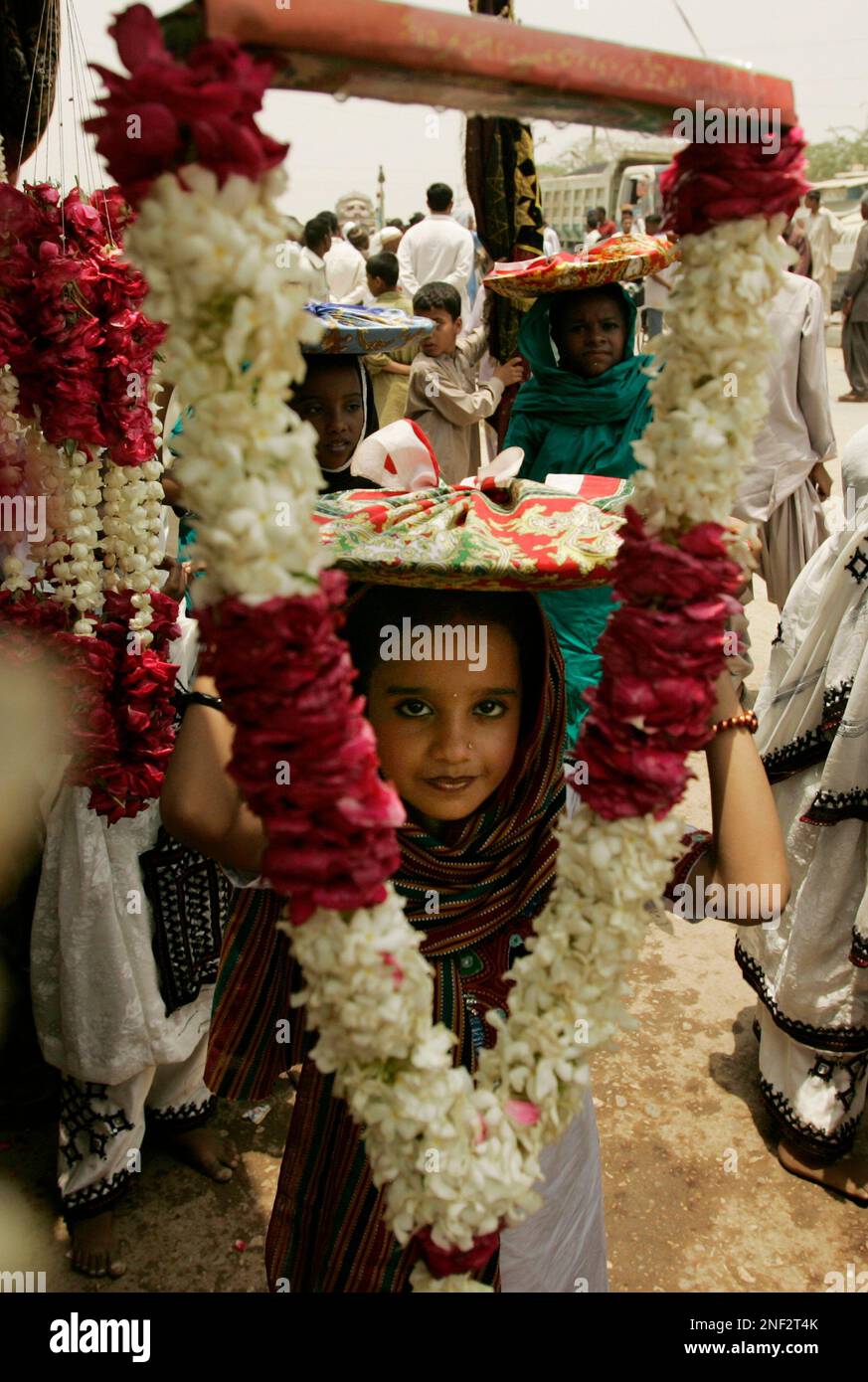 Ethnic Pakistani Sheedi devotees celebrate during a crocodile festival ...