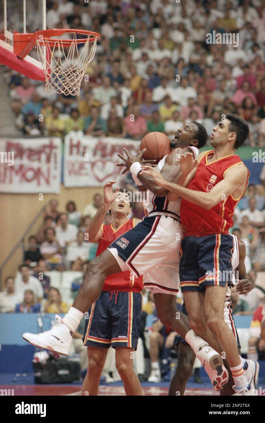 U.S. team’s Karl Malone grabs a rebound from Spain’s Santiago Aldama ...