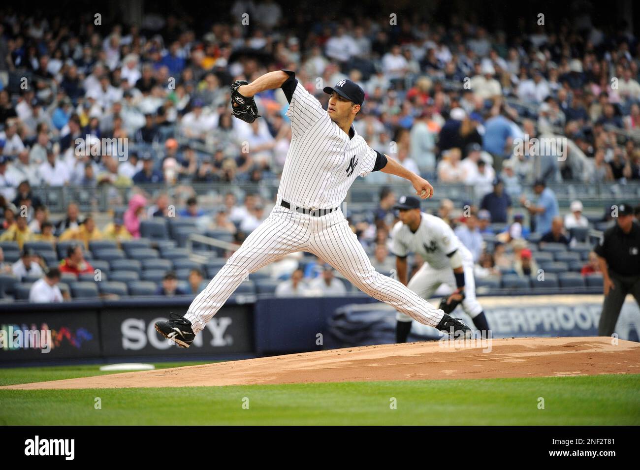 New York Yankees pitcher Andy Pettitte delivers the ball during a ...