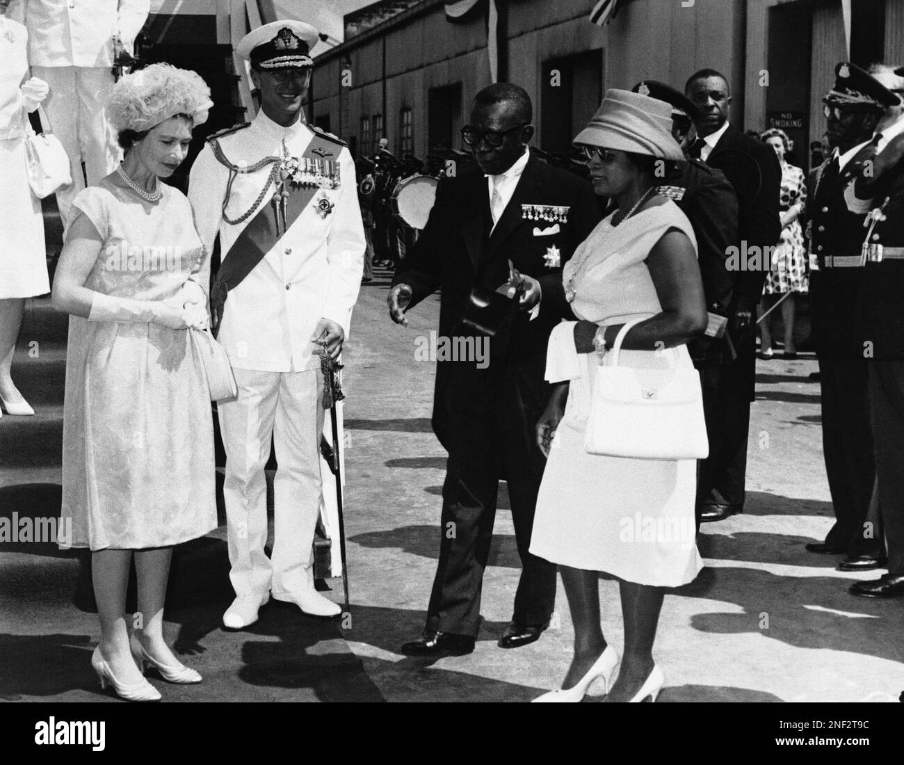 Britain's Queen Elizabeth II and Prince Philip, left, were greeted by ...