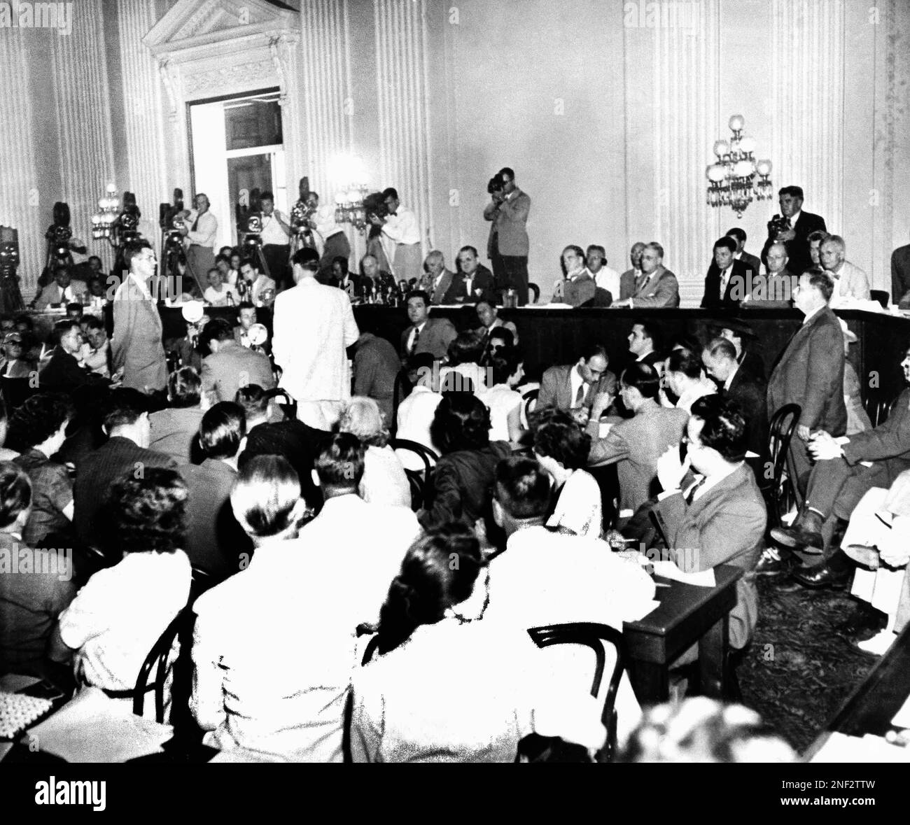 Alger Hiss, standing, left, and Whittaker Chambers, standing, right ...