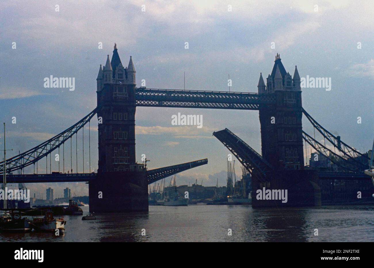 London’s famous tower bridge lifts it’s bascules for giant ship to pass ...