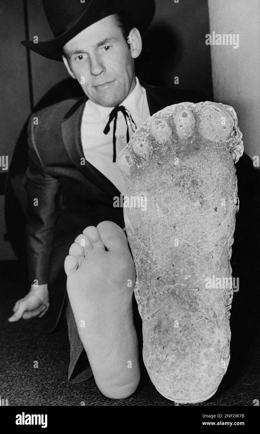 Photographer Roger Patterson compares his foot with cast in Los Angeles ...