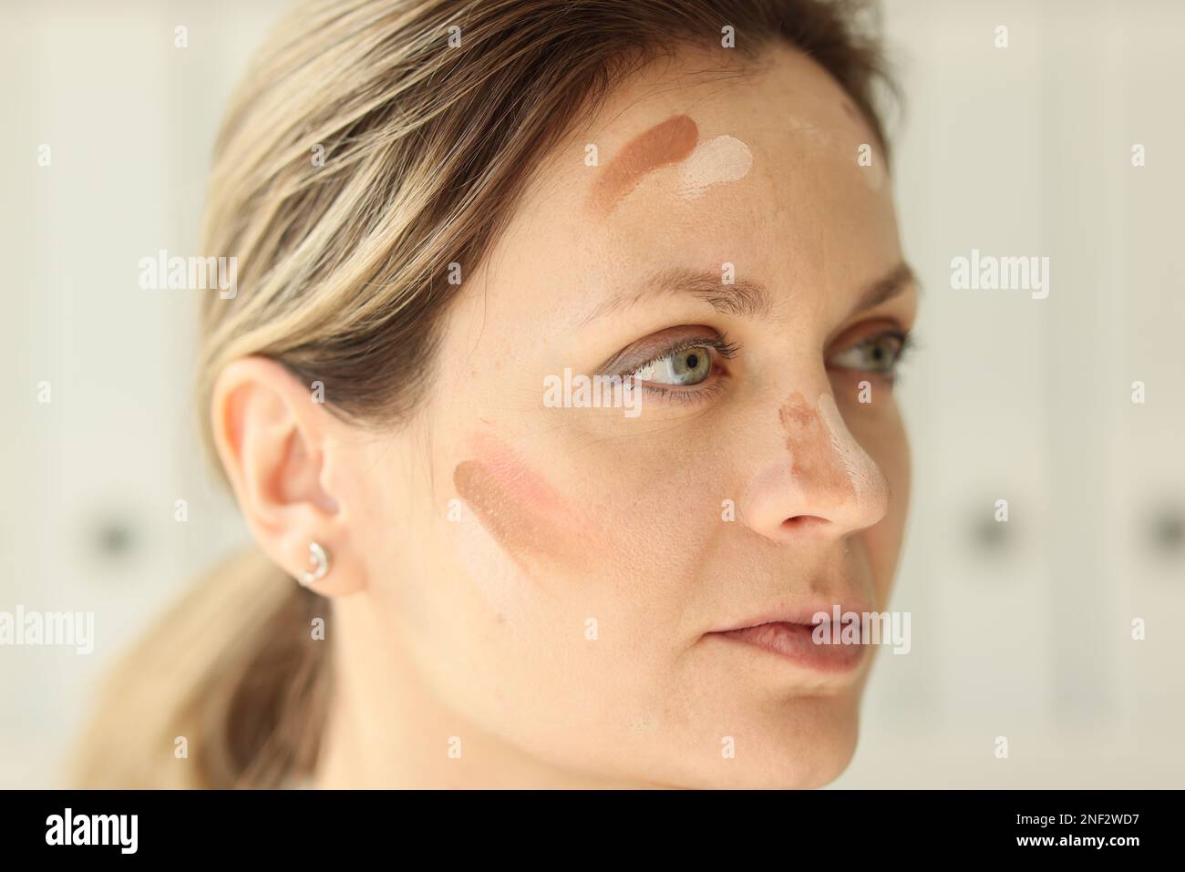 A close-up on the female face of a tonal cream smear Stock Photo - Alamy