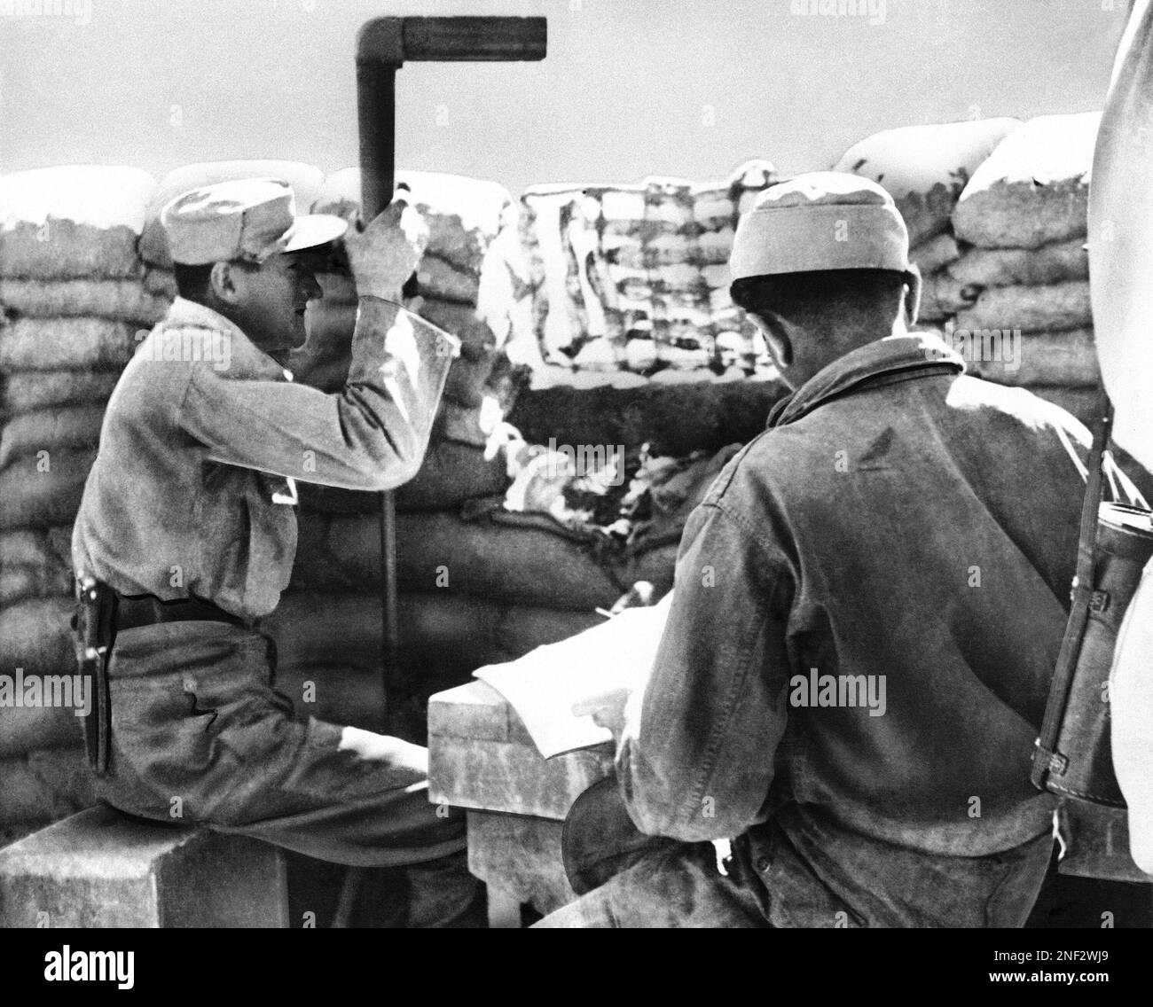 Two artillery spotters of the Israeli army work from a sandbagged ...