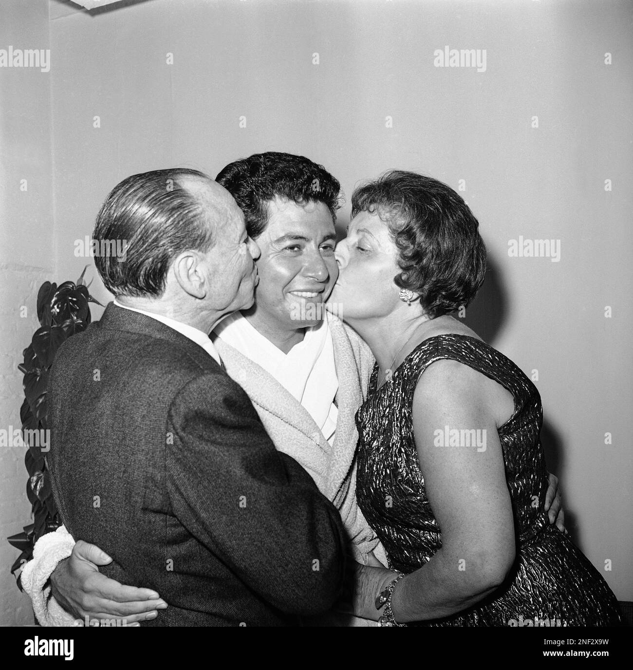 Singer Eddie Fisher, center, is shown backstage following opening night ...