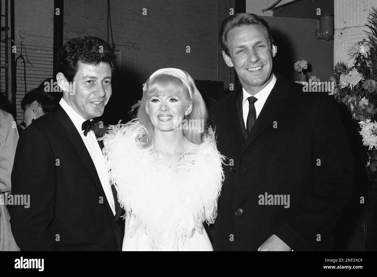 Connie Stevens is flanked by singer Eddie Fisher, left, and actor Ron ...