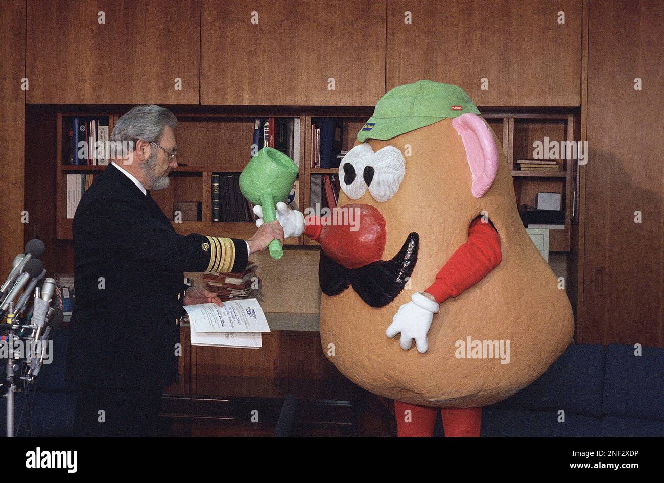 Surgeon General C. Everett Koop accepts the pipe from Mr. Potato Head ...