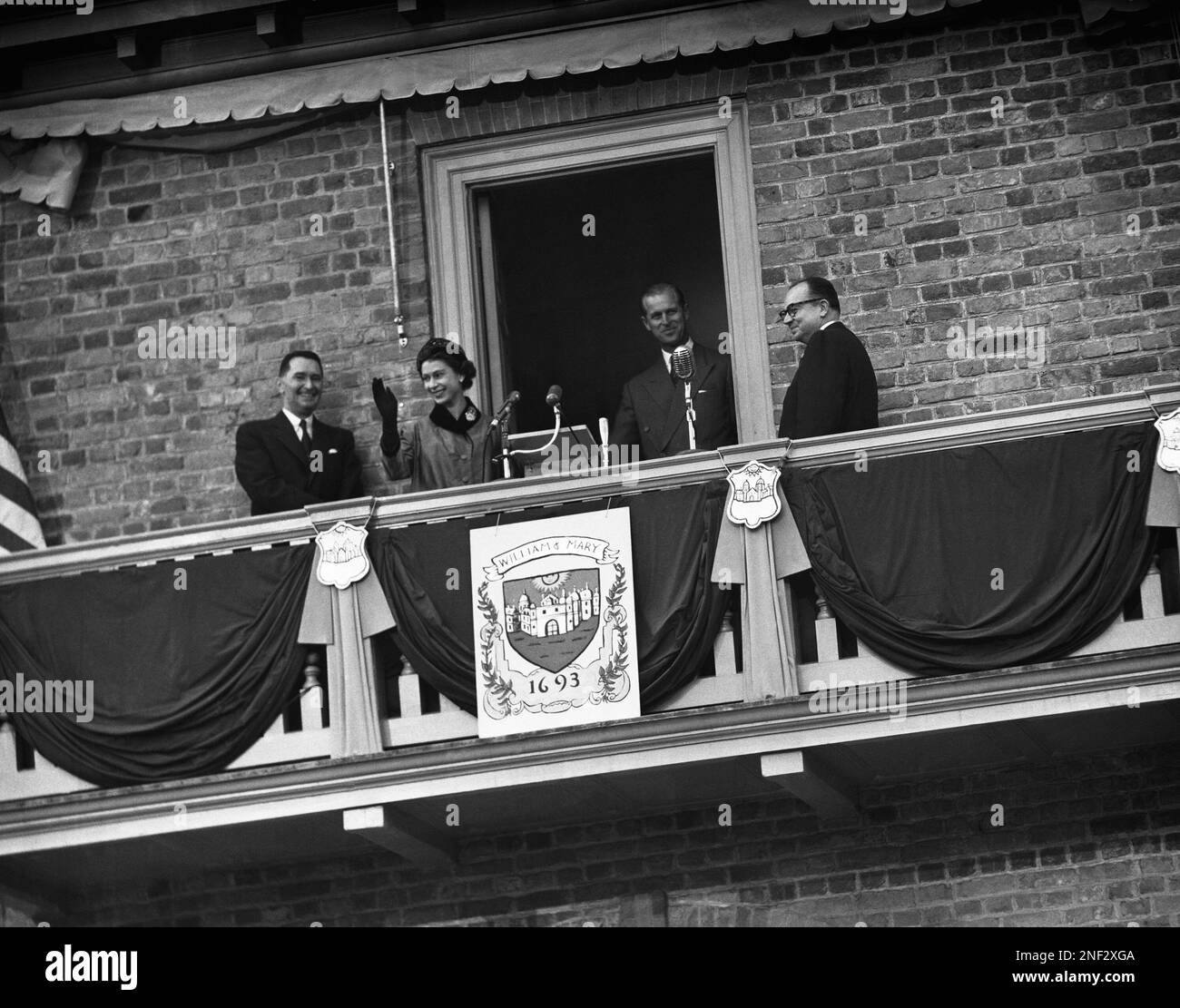 Queen Elizabeth II waves from the balcony of the Wren building of the ...