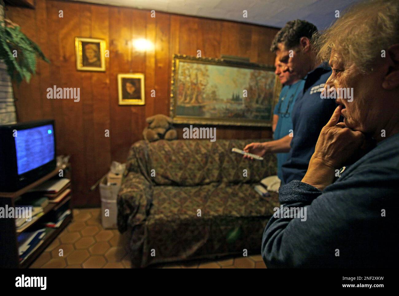 Kitty Bigin, left, looks on along with her husband Bill, far right, as ...