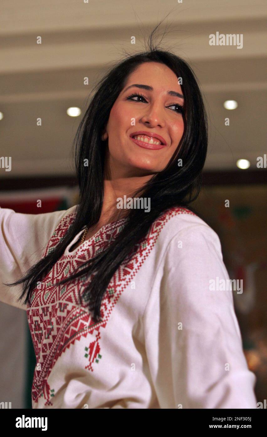 A Palestinian model displays a traditional Palestinian customs in a fashion show in Amman ...