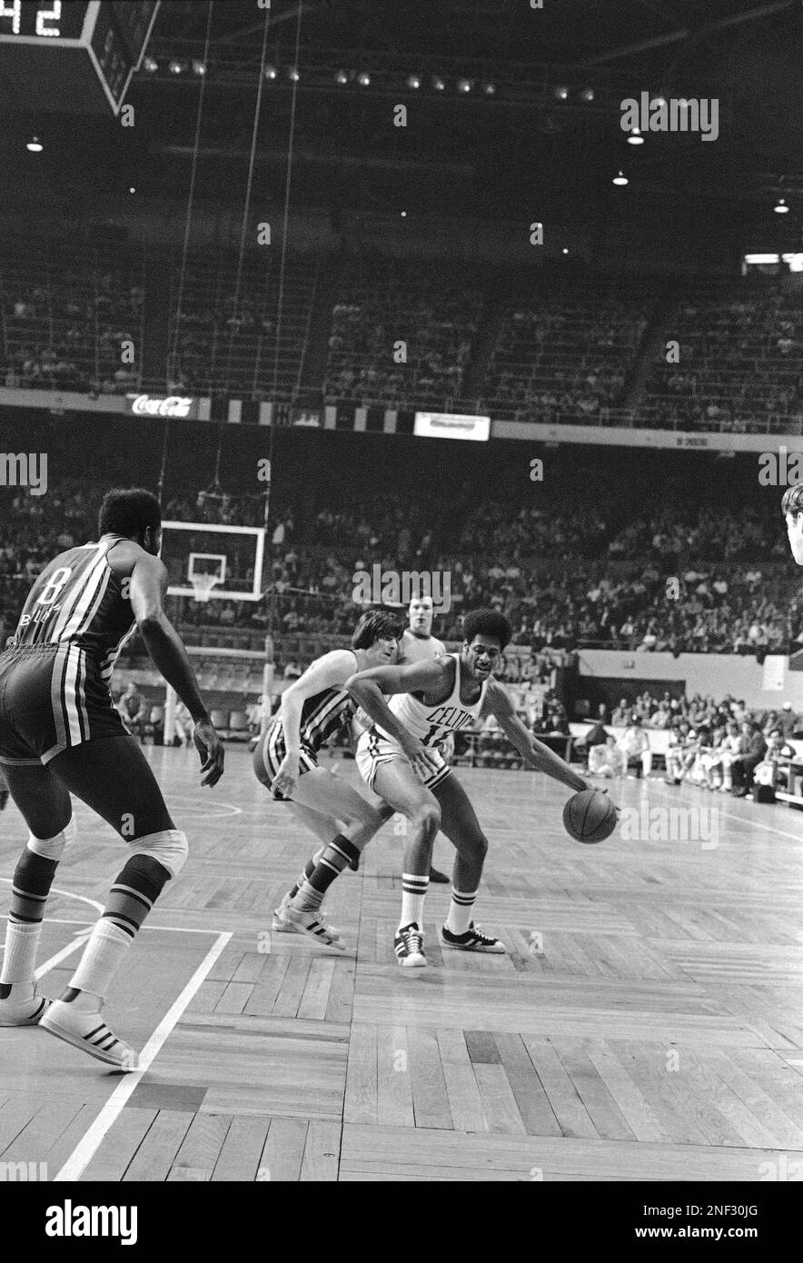 Boston Celtics’ Don Chaney dribbles ball around Atlanta Hawks’ Pete ...