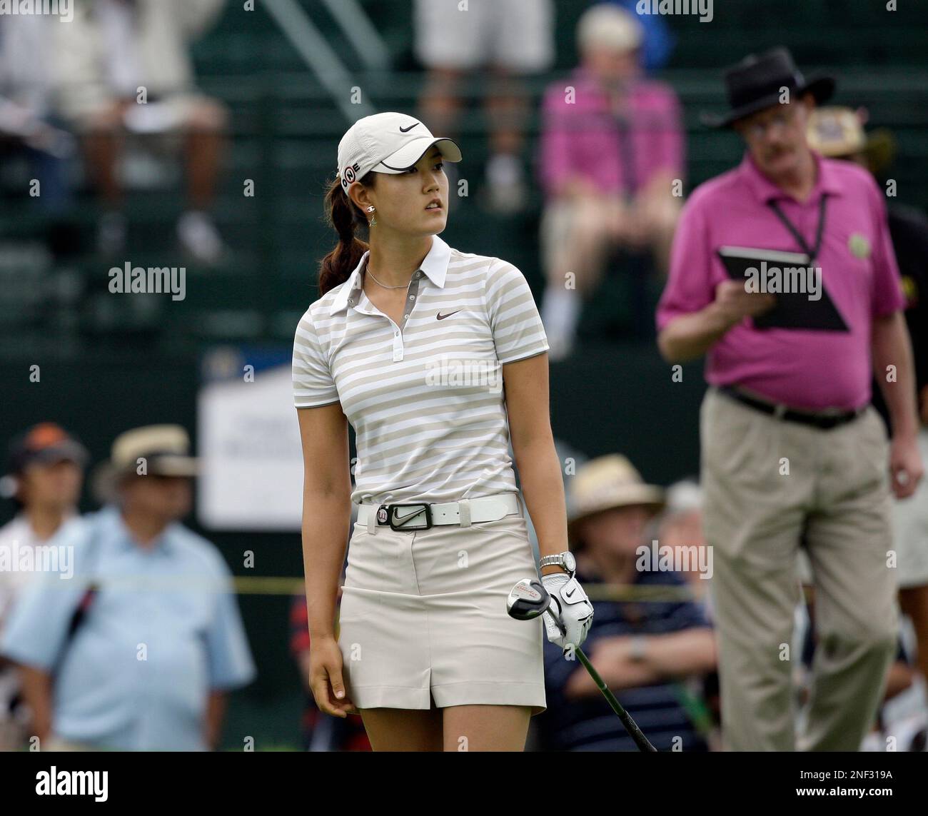 Michelle Wie follows her tee shot on the first hole during the first ...