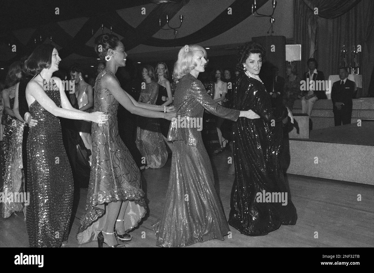 Jane Russell leads a conga line of fashion models during the ...