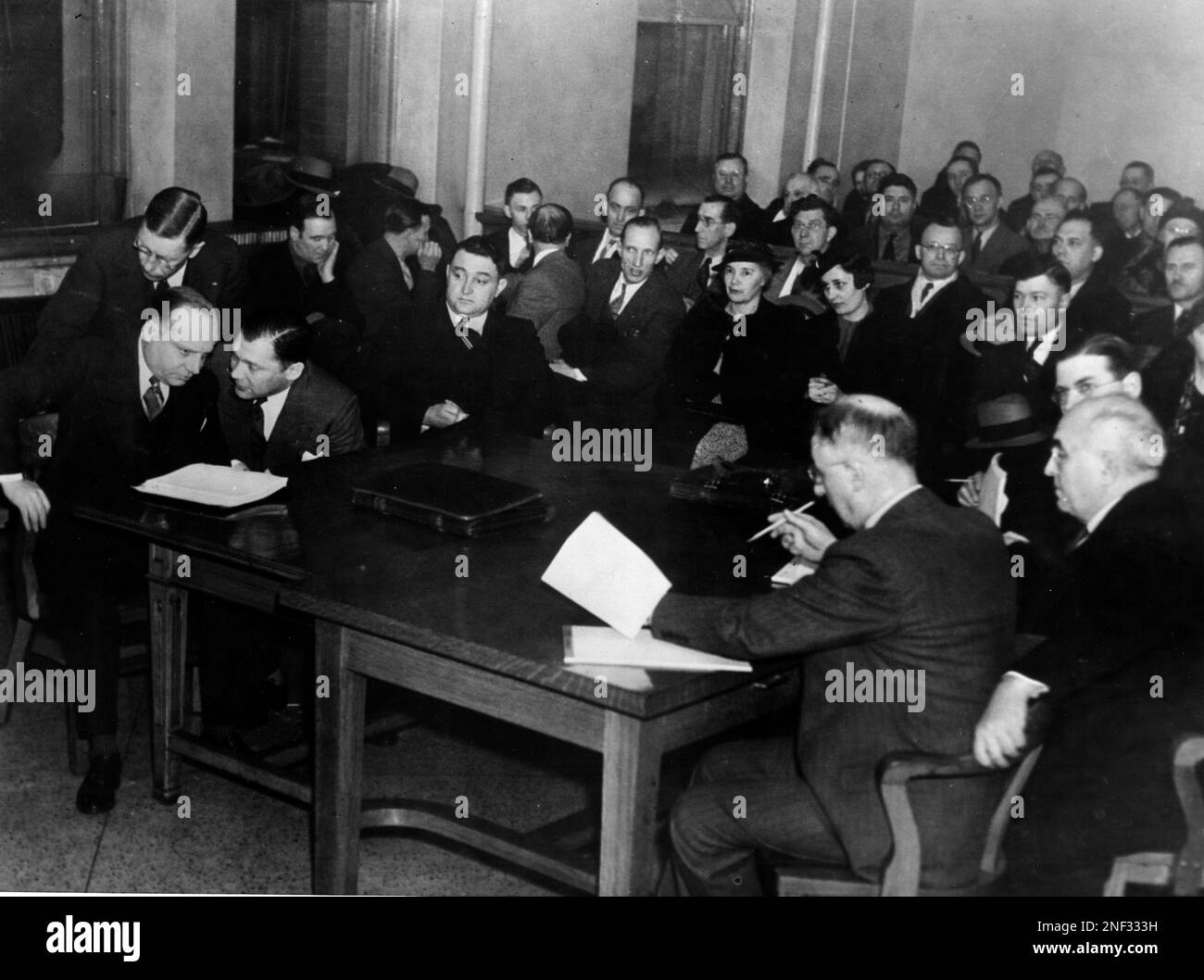 Attorneys are shown conferring as trial of Isadore "Kid Cann ...
