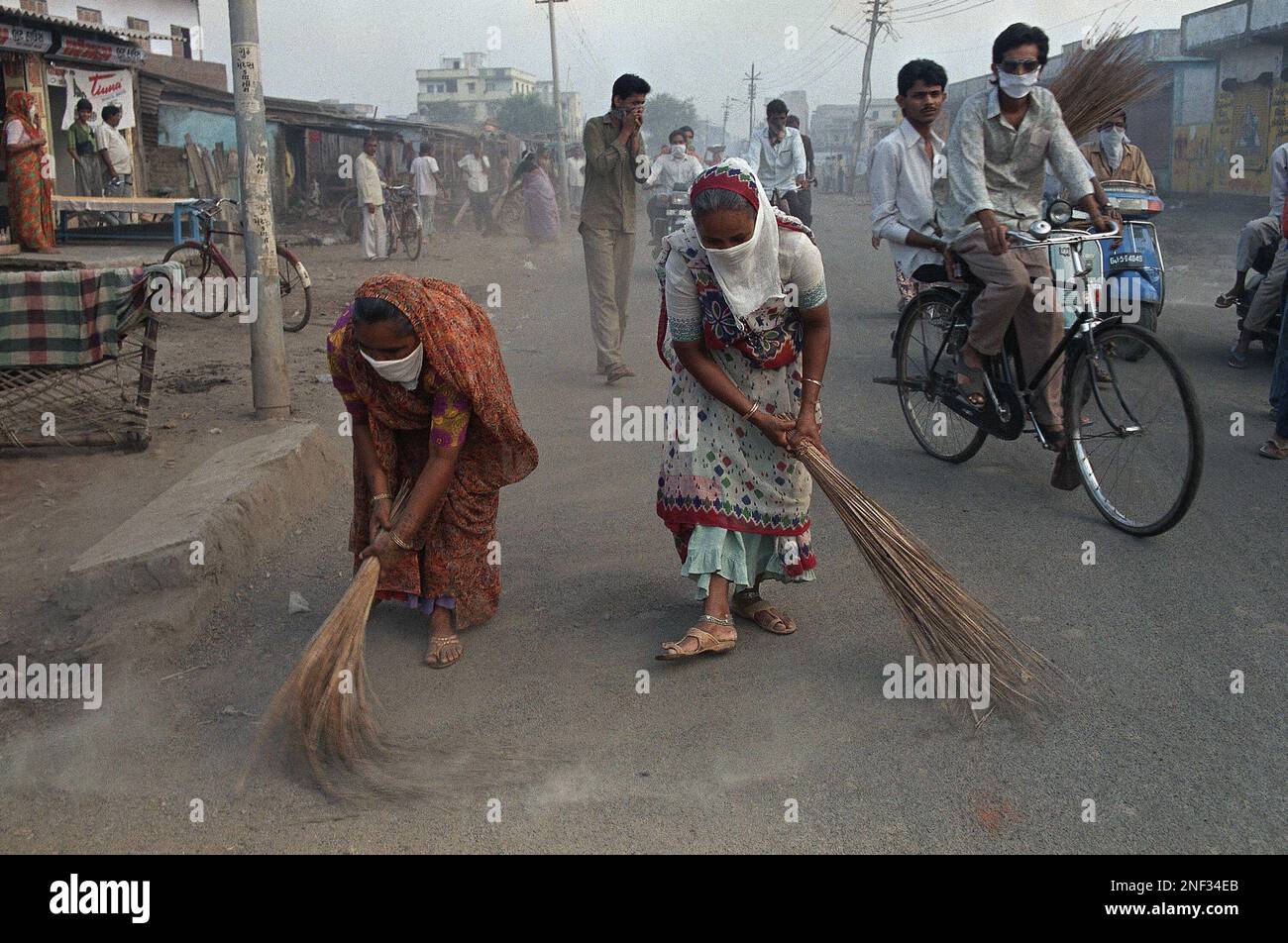 Sweepers clean the streets of plague-hit Surat, India, Sept. 28, 1994 ...