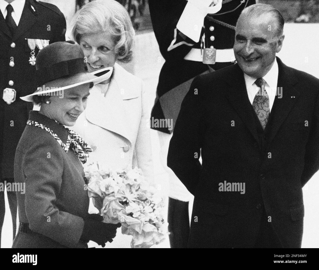 Queen Elizabeth II of England, holding a bouquet of Flowers, and French ...
