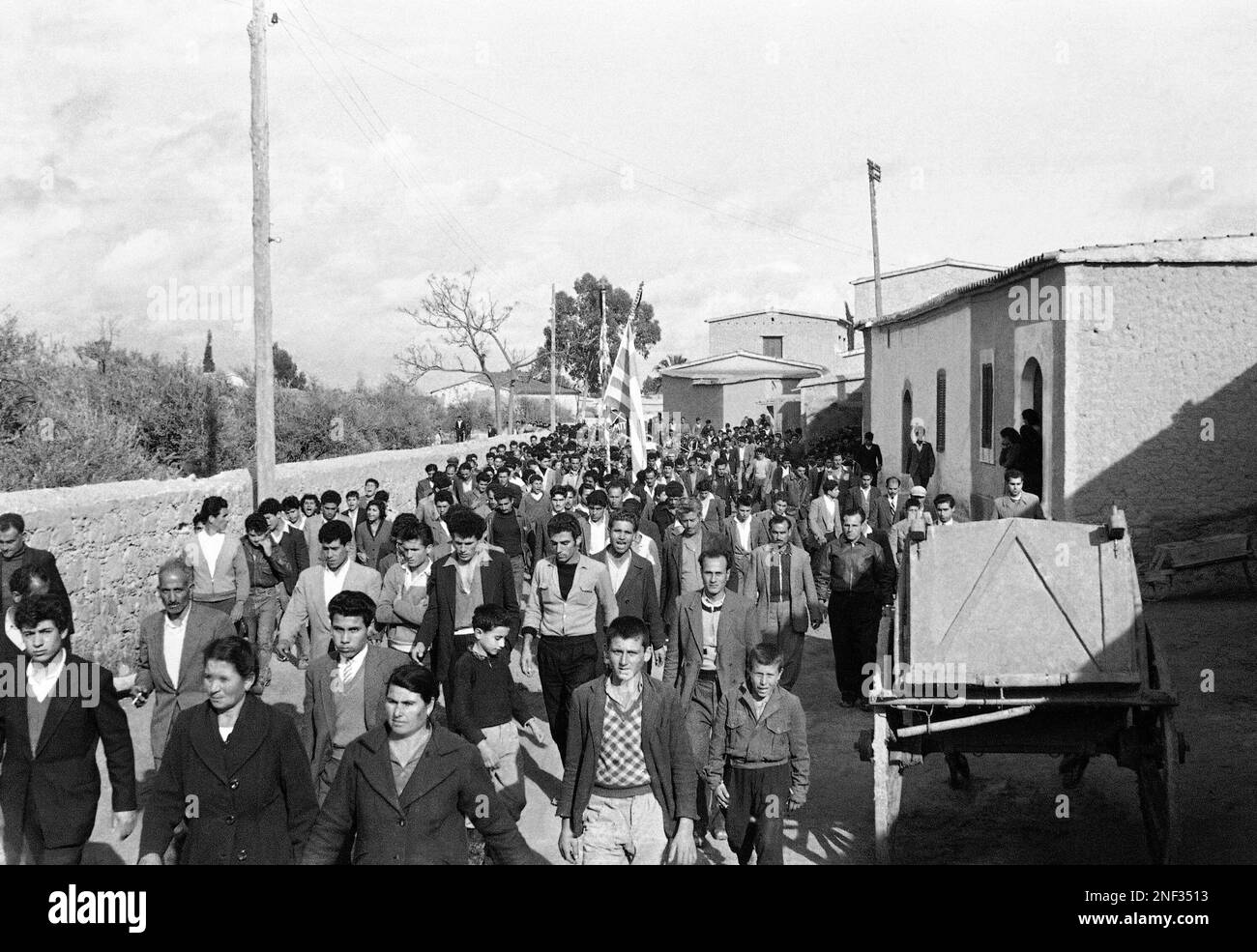 Cypriots march through Lyssi Village, Cyprus in 1958 during ...