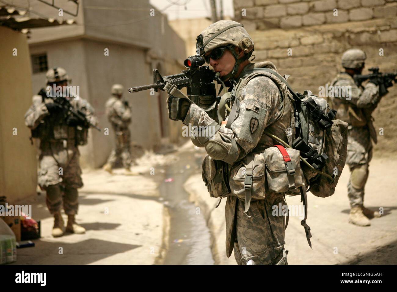 U.S. Army Spc. Alexander Costea, center, from A Co., 1st Battalion, 5th ...