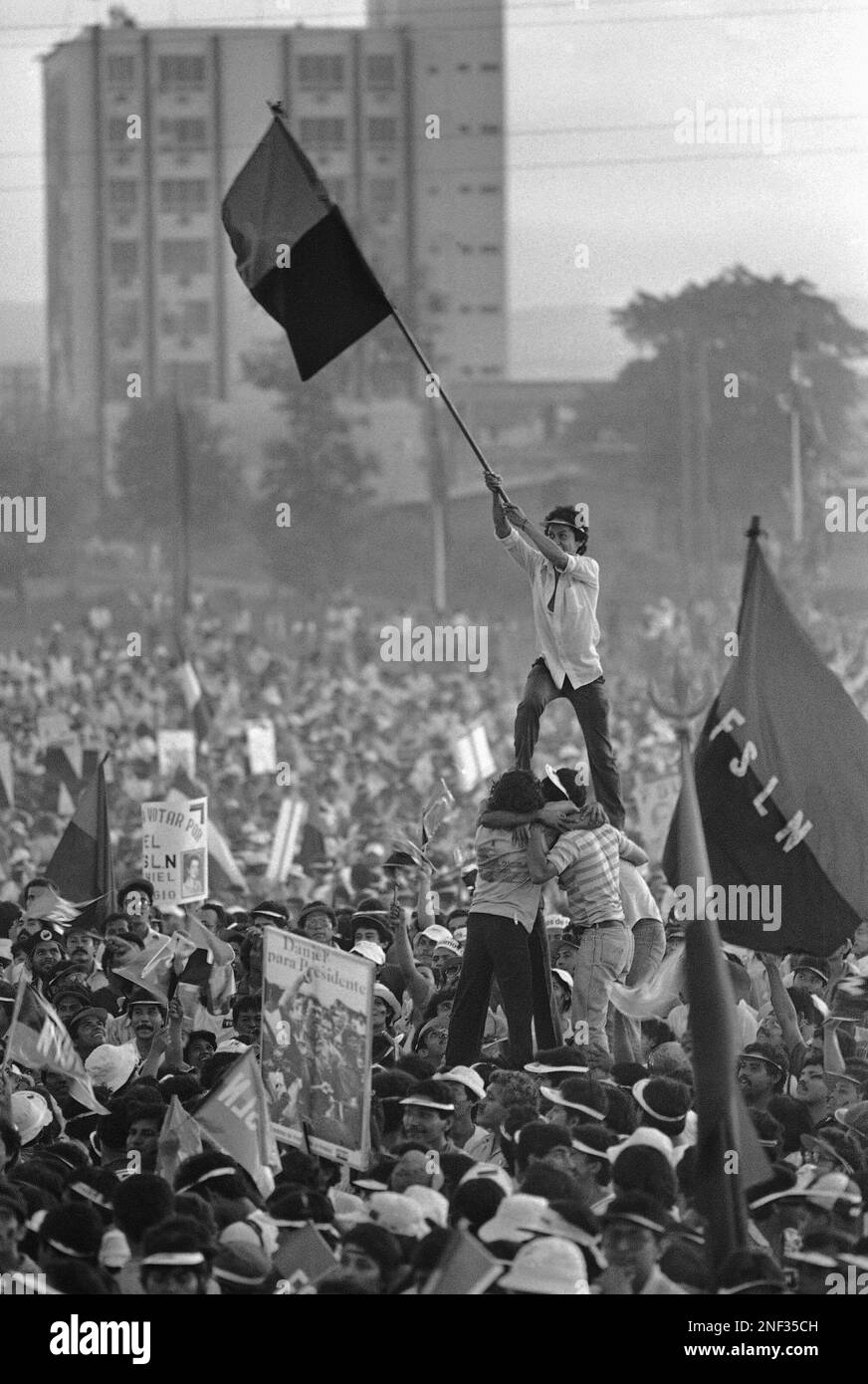 Sandinista youth form a human pyramid waving their party colors in ...