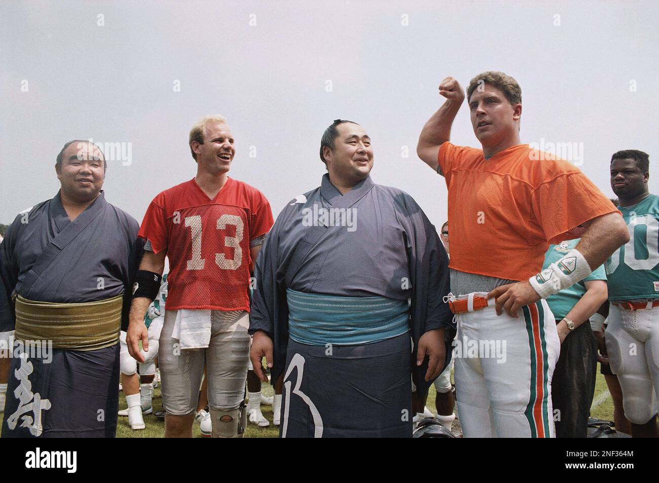 Miami Dolphins quarterback Dan Marino, right, strikes a pose Friday as ...