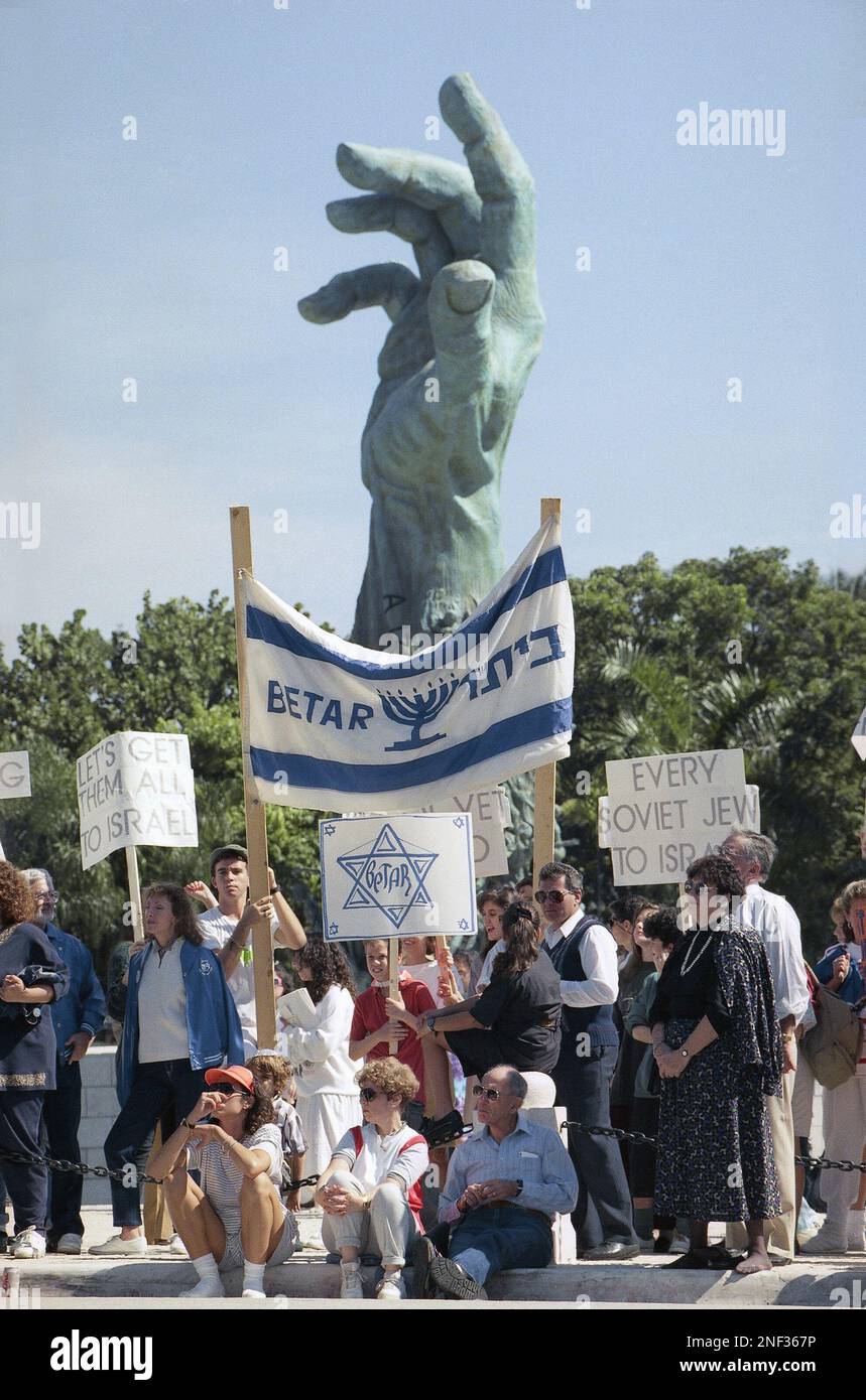 Members of Miami’s Jewish community gather at the Holocaust Memorial on ...