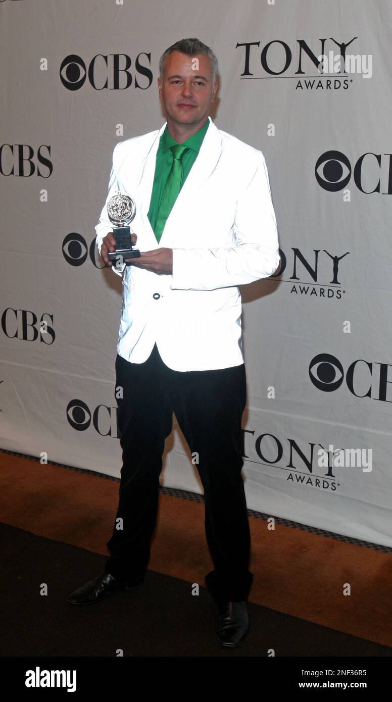 Tim Hatley poses in a reflective jacket with his trophy for Best ...